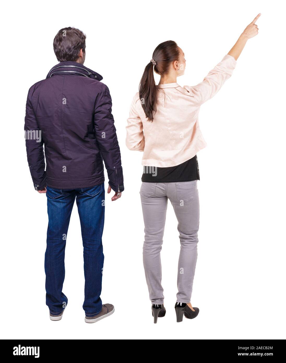 Back view of a stylish couple pointing. beautiful friendly girl and guy ...