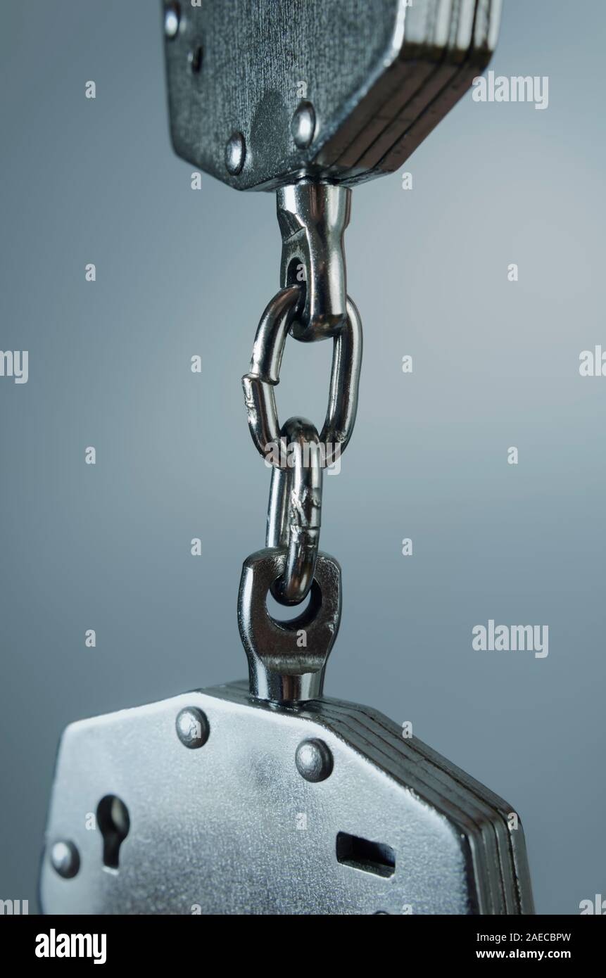 Closeup of chain of police handcuffs Stock Photo - Alamy