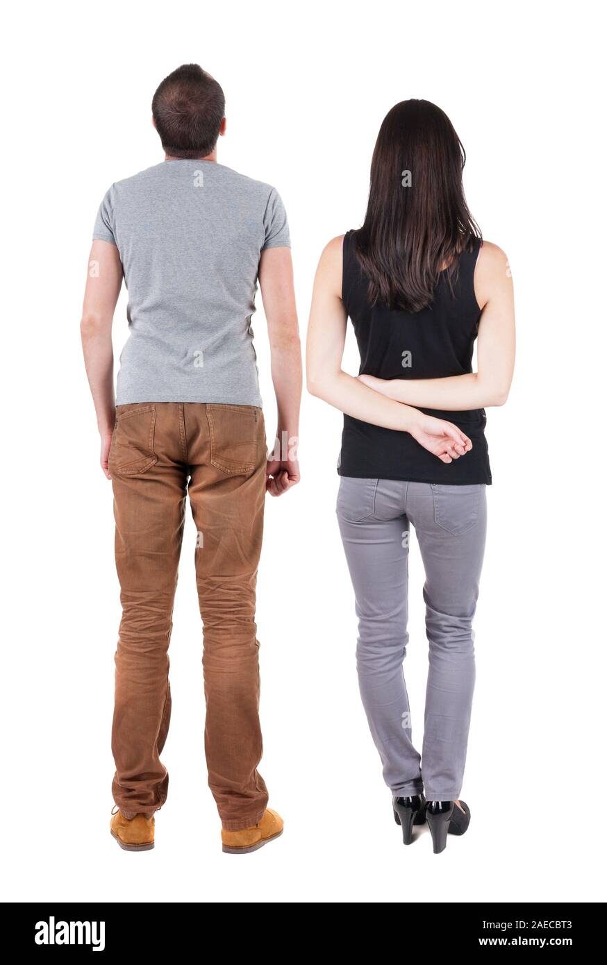 Back view of couple. beautiful friendly girl and guy together. Rear ...