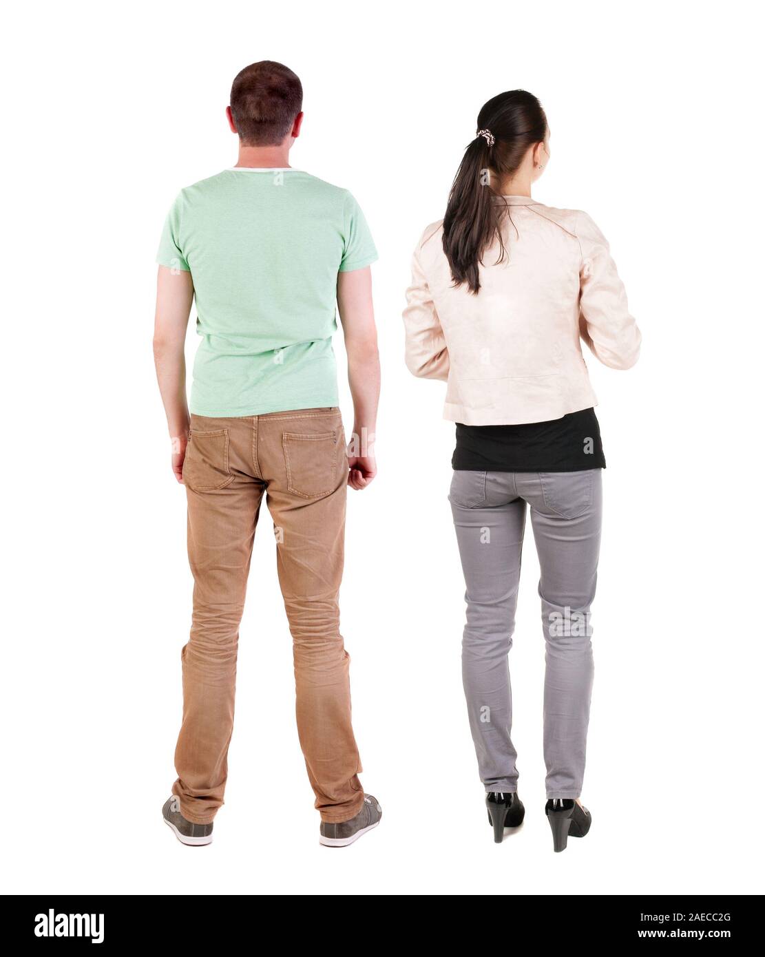 Back view of couple. beautiful friendly girl and guy together. Rear ...