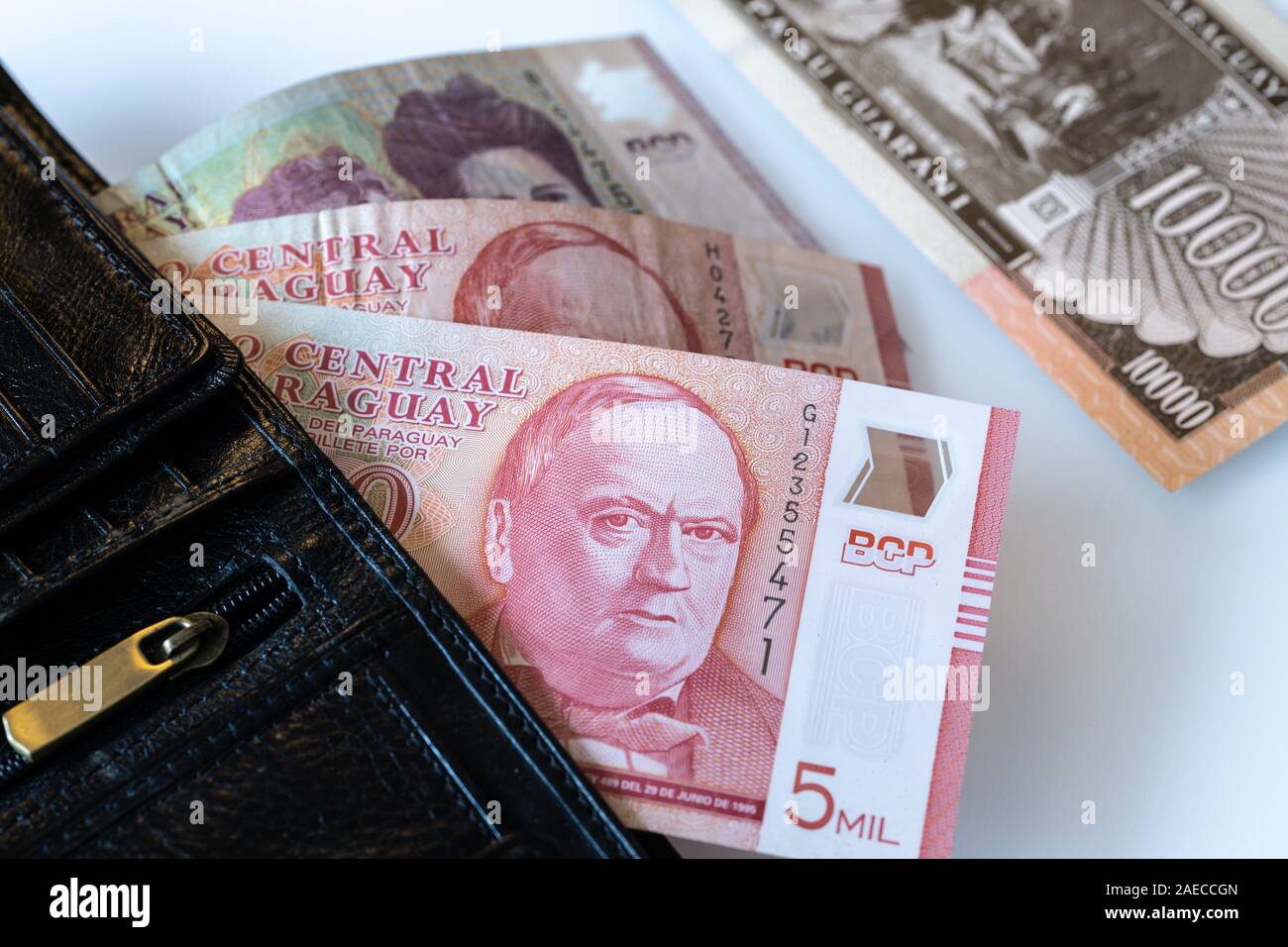 Paraguay banknotes, Guaranies sticking out of the wallet Stock Photo ...