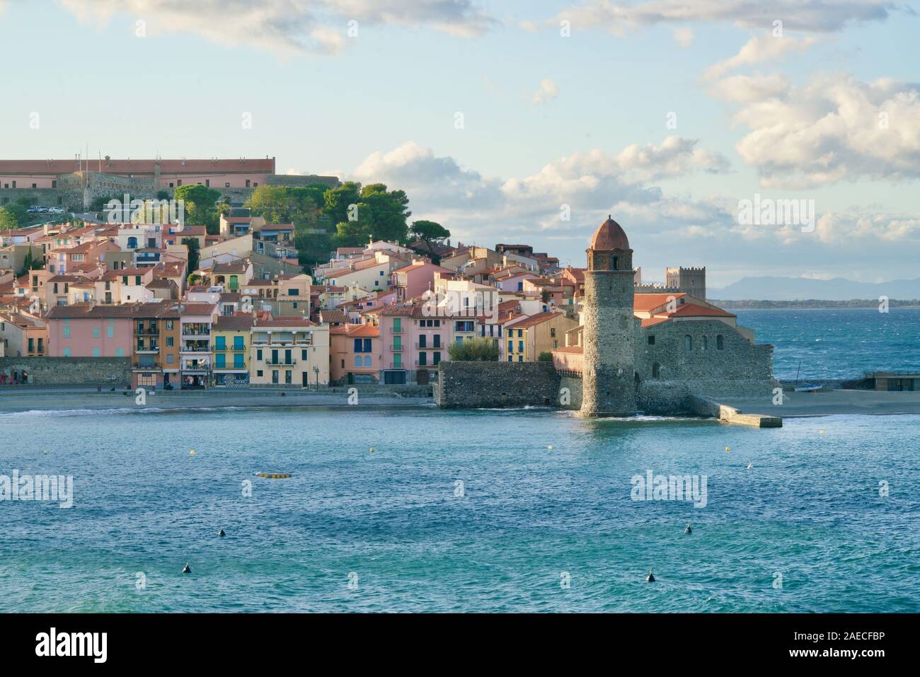 Houses around a medieval church at the sea Stock Photo - Alamy