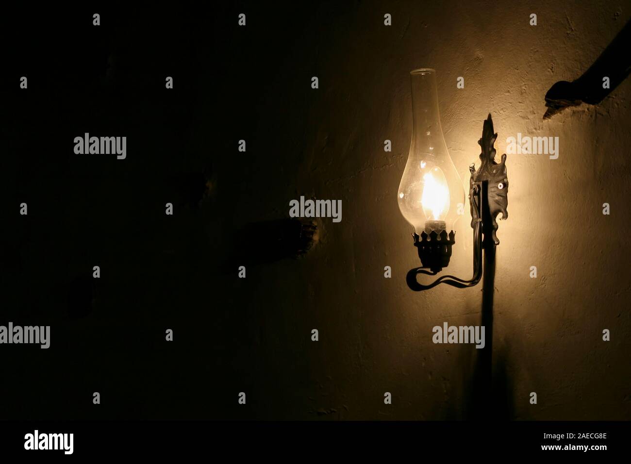 Gas lamp hanging on Wall in village house Stock Photo - Alamy