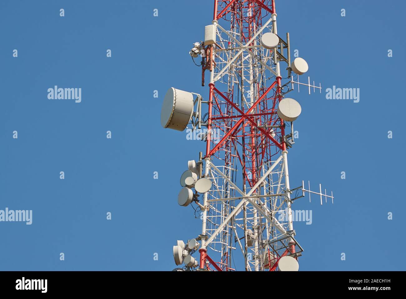 Transmitter towers, blue sky Stock Photo - Alamy