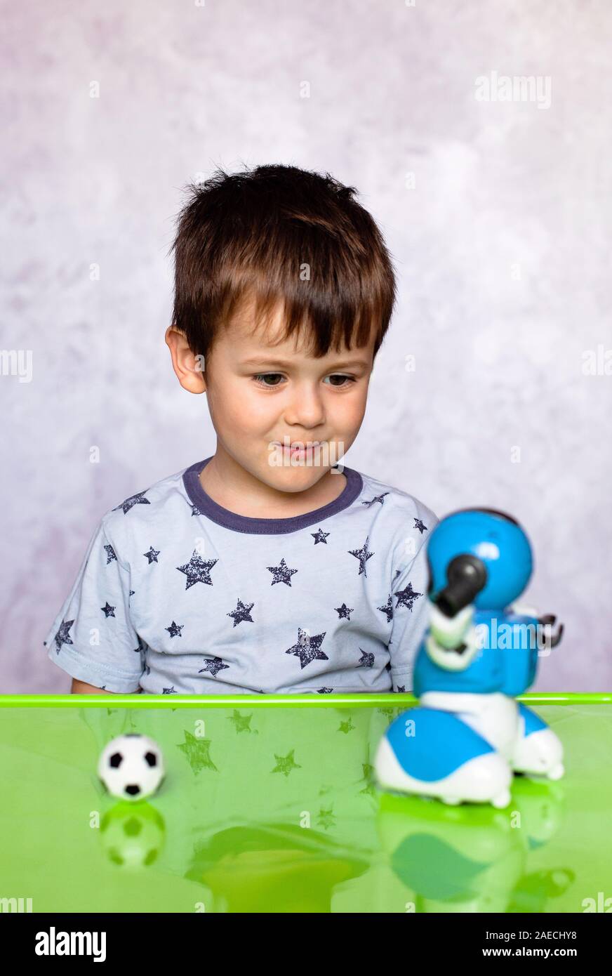 Little boy is playing with robot. Robot for children. Smart toy Stock ...