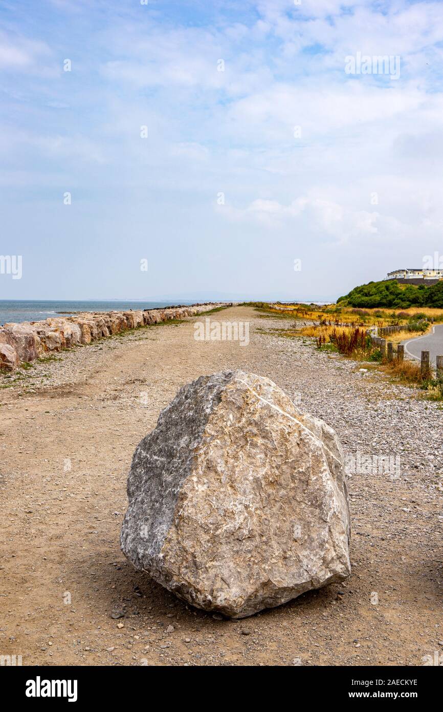 Single boulder blocking access to beach in North Wales UK Stock Photo ...