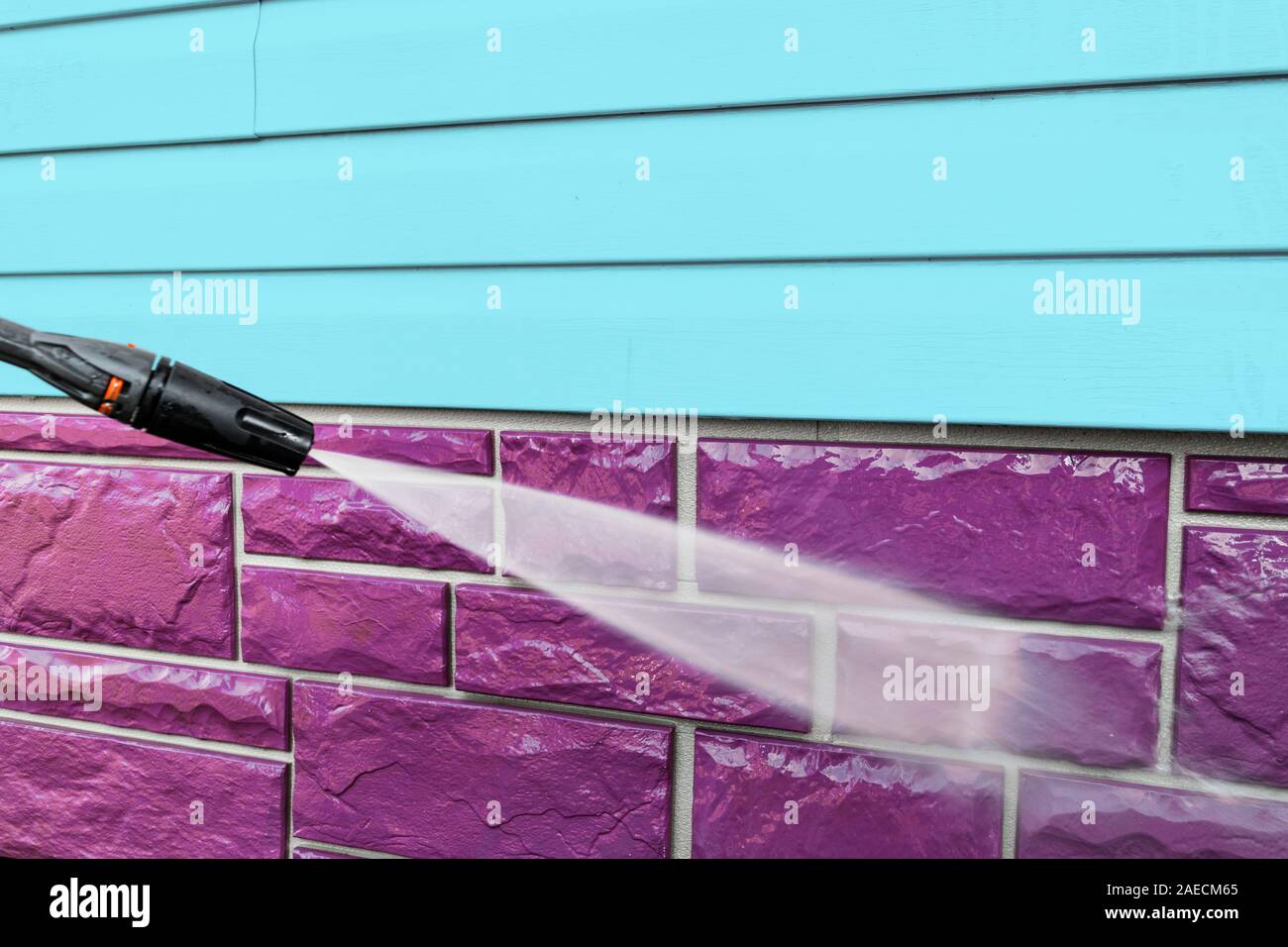 Cleaning service washing building facade with pressure water. Cleaning ...