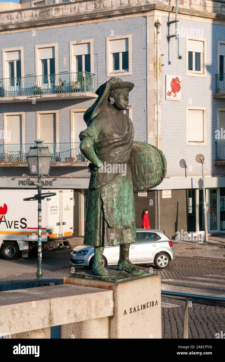 Bronze statue of a female salt worker (Salineira) overlooking the canal ...