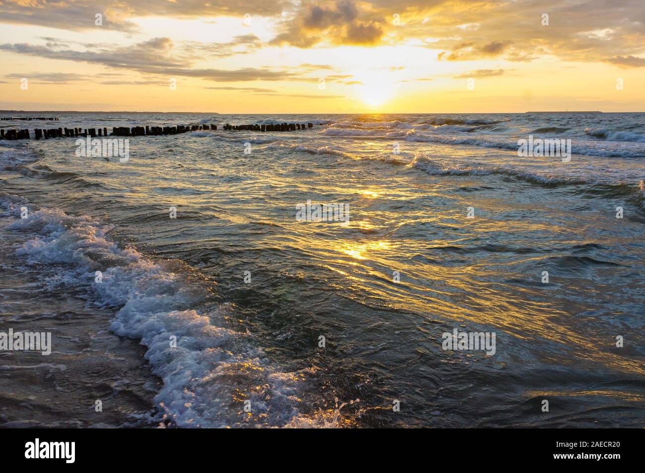 Sunset over the sea. Reflection of sunlight in the sea waves. Red sky ...