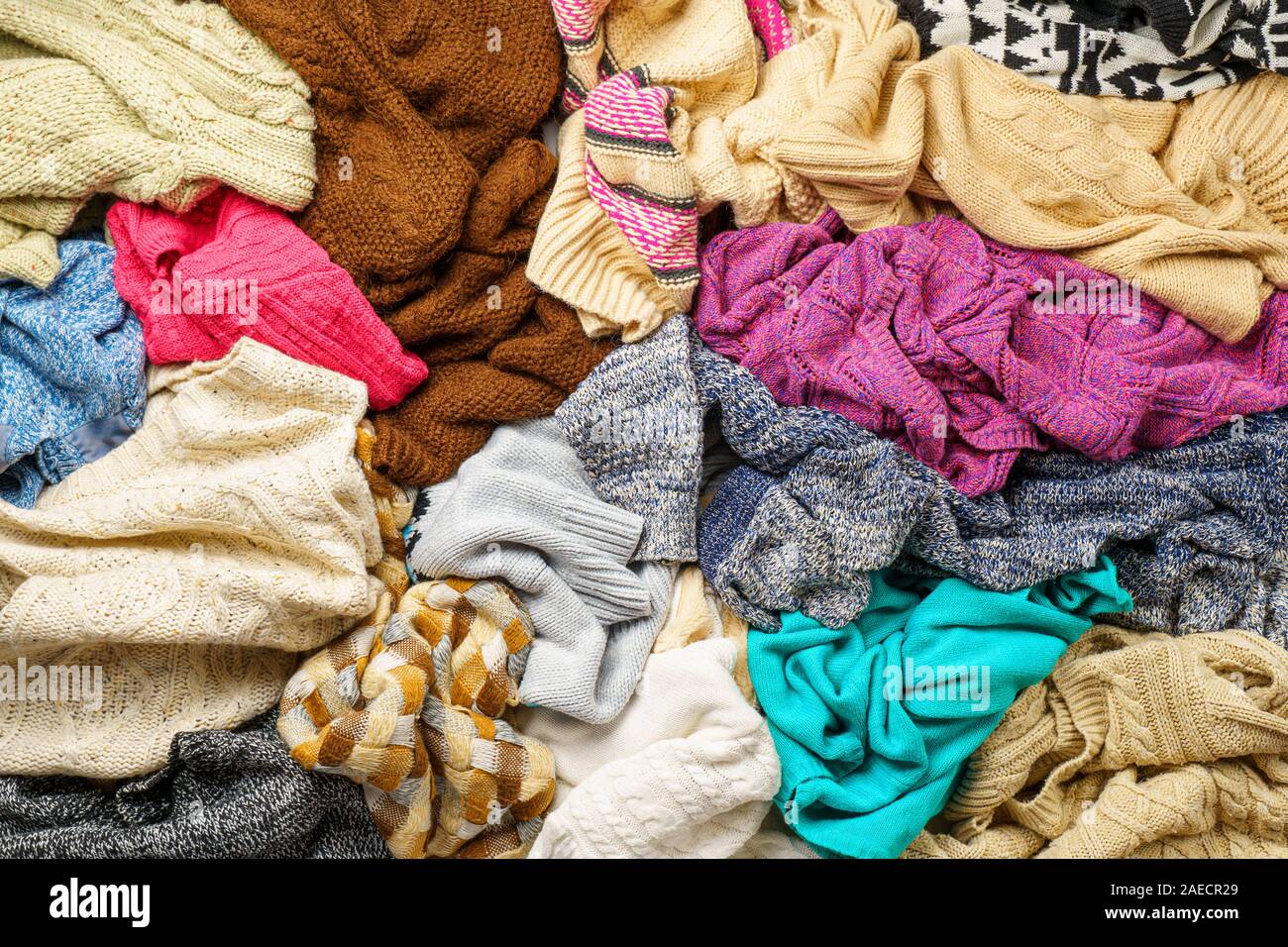 A Bunch of Different Clothes. Recyclable Textile Background. Sorting at ...