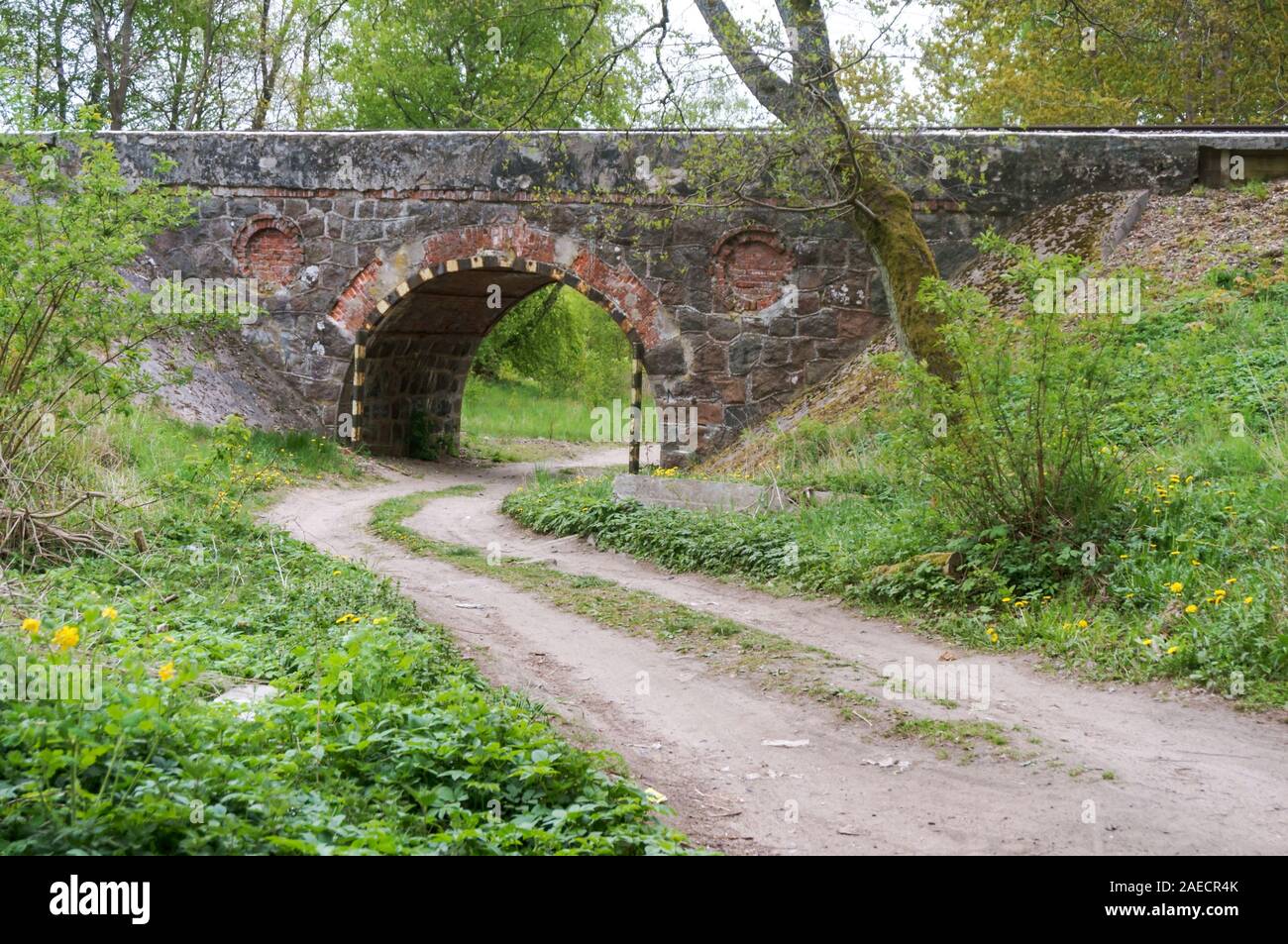 arched passage under the railway, arched bridge over a country road ...