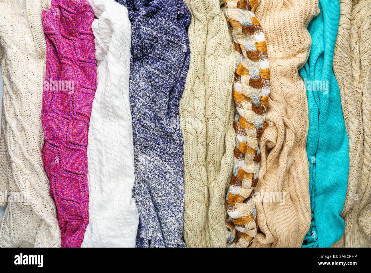 Several Different Colorful Knitted Sweaters Lays Side by Side as ...