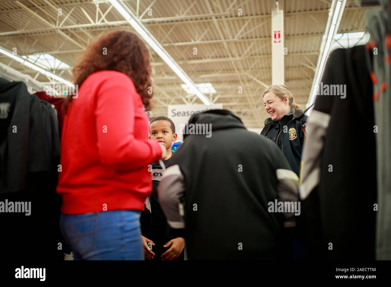 Brian Kincade looks up at Rachel Tooley while choosing clothes with the ...