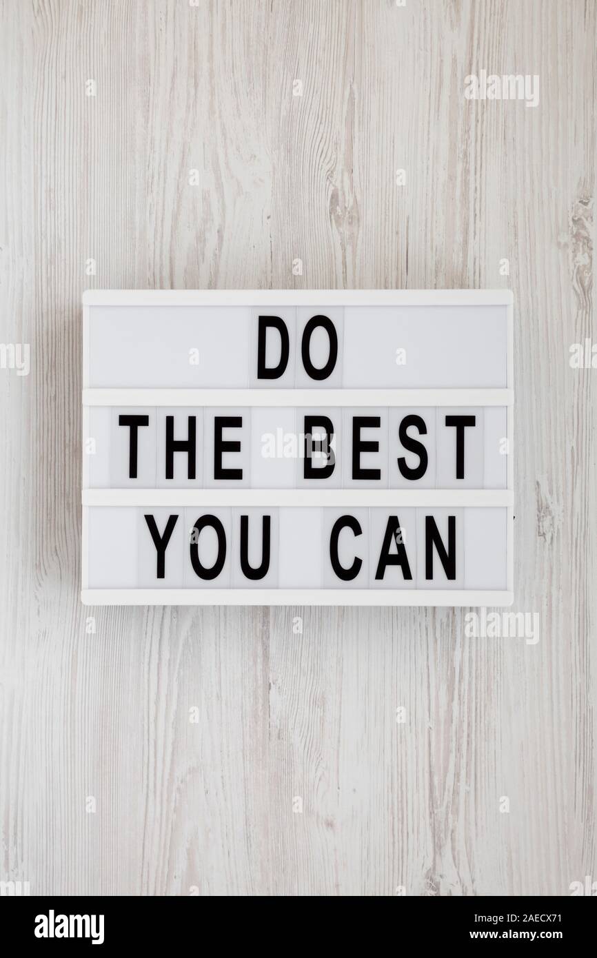 'Do the best you can' words on a modern board on a white wooden ...