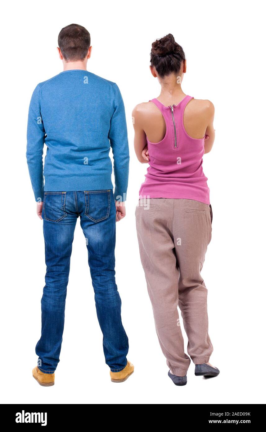 Back view of couple. beautiful friendly girl and guy together. Rear ...
