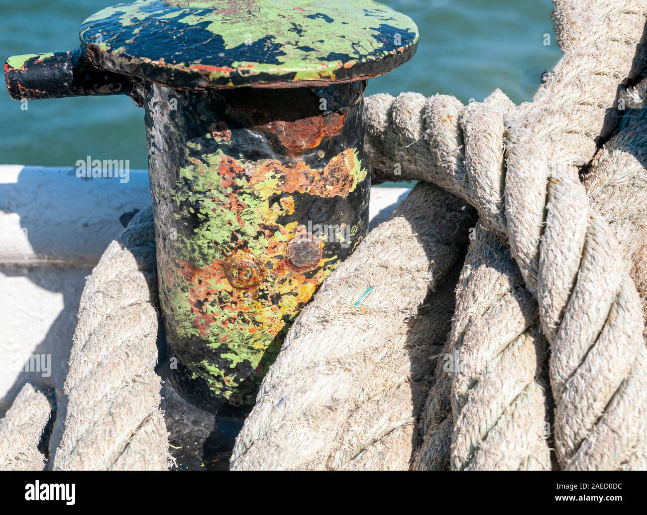 Weathered rope wrapped around a bollard on a ferryboat Stock Photo - Alamy