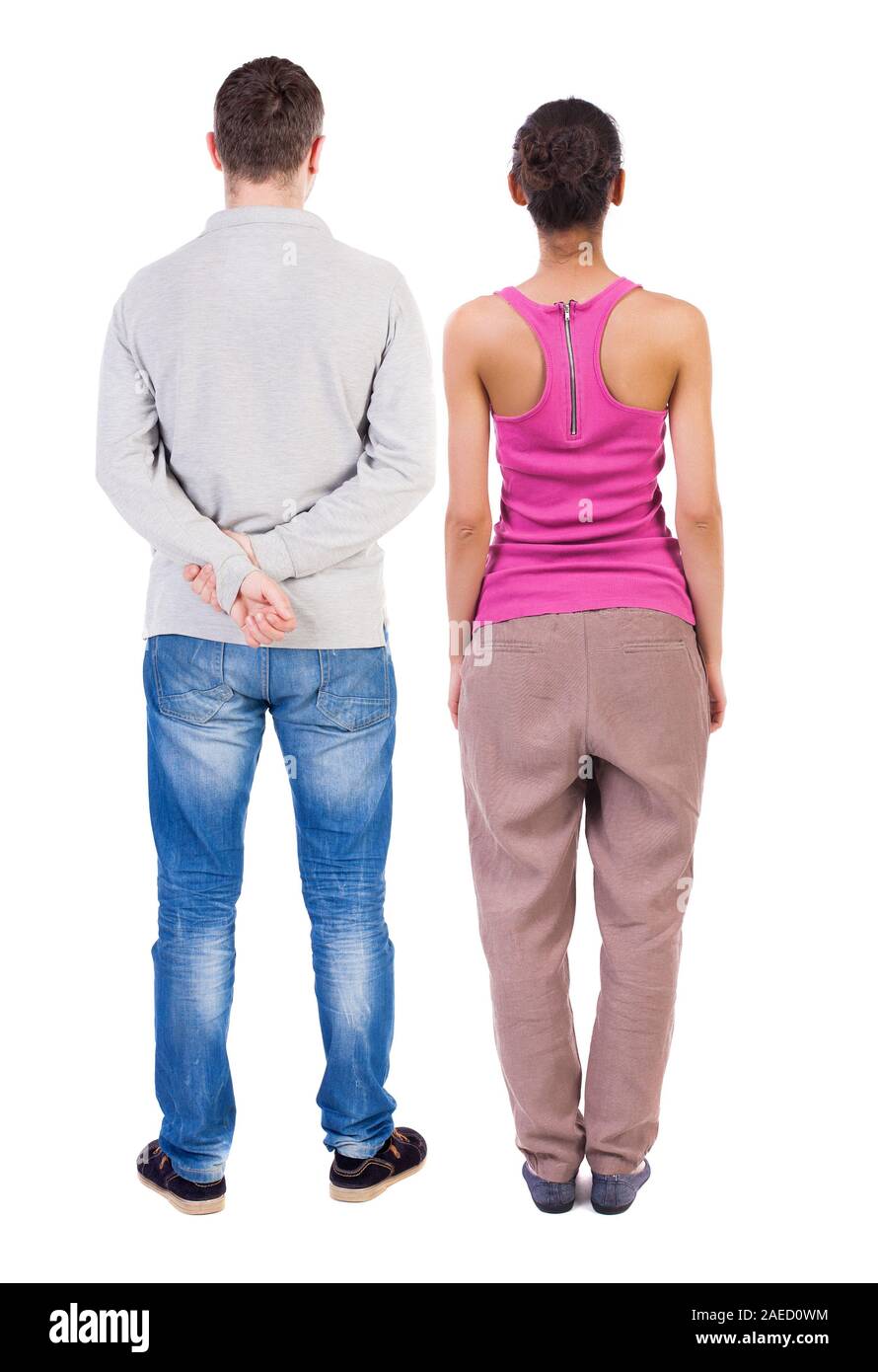 Back view of couple. beautiful friendly girl and guy together. Rear ...