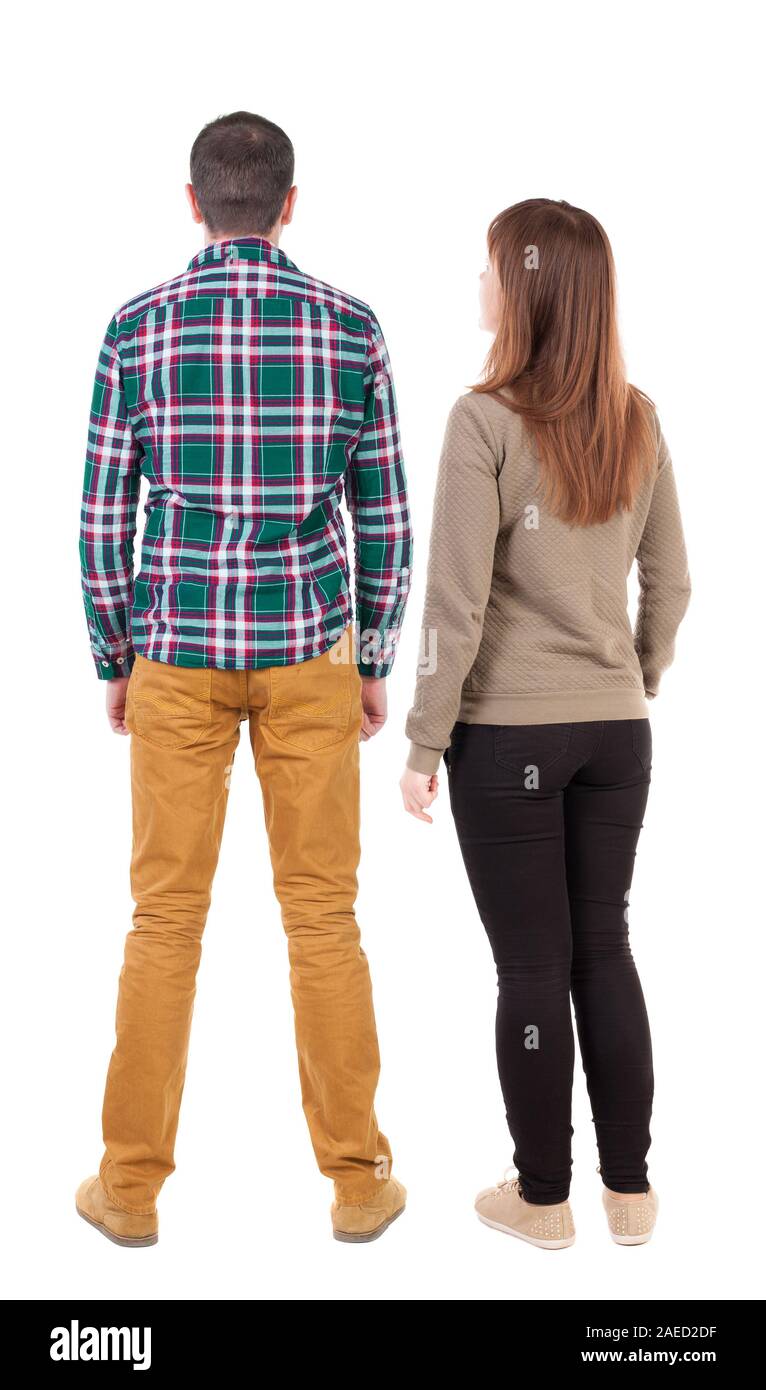 Back view of couple. beautiful friendly girl and guy together. Rear ...