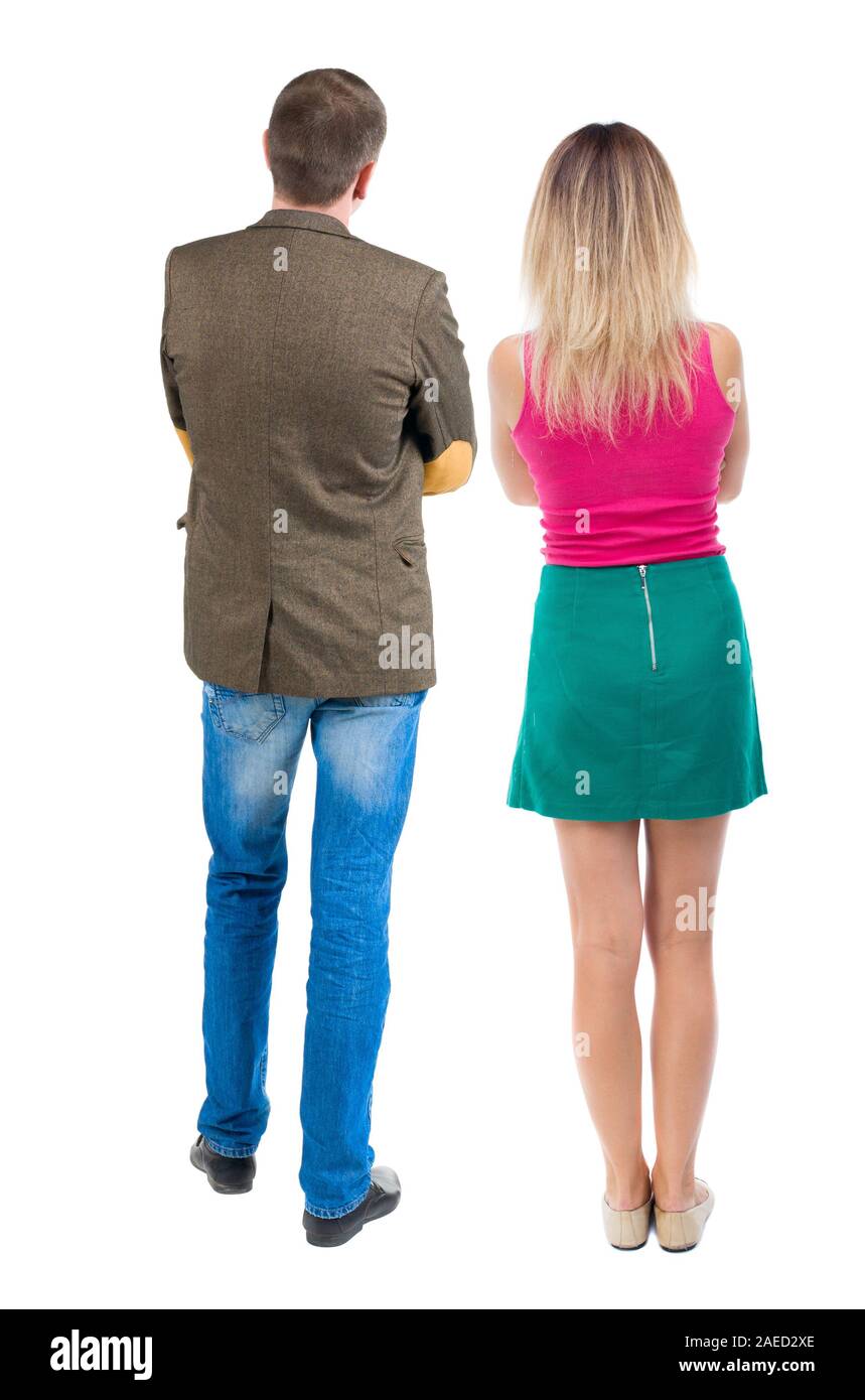 Back view of couple. beautiful friendly girl and guy together. Rear ...