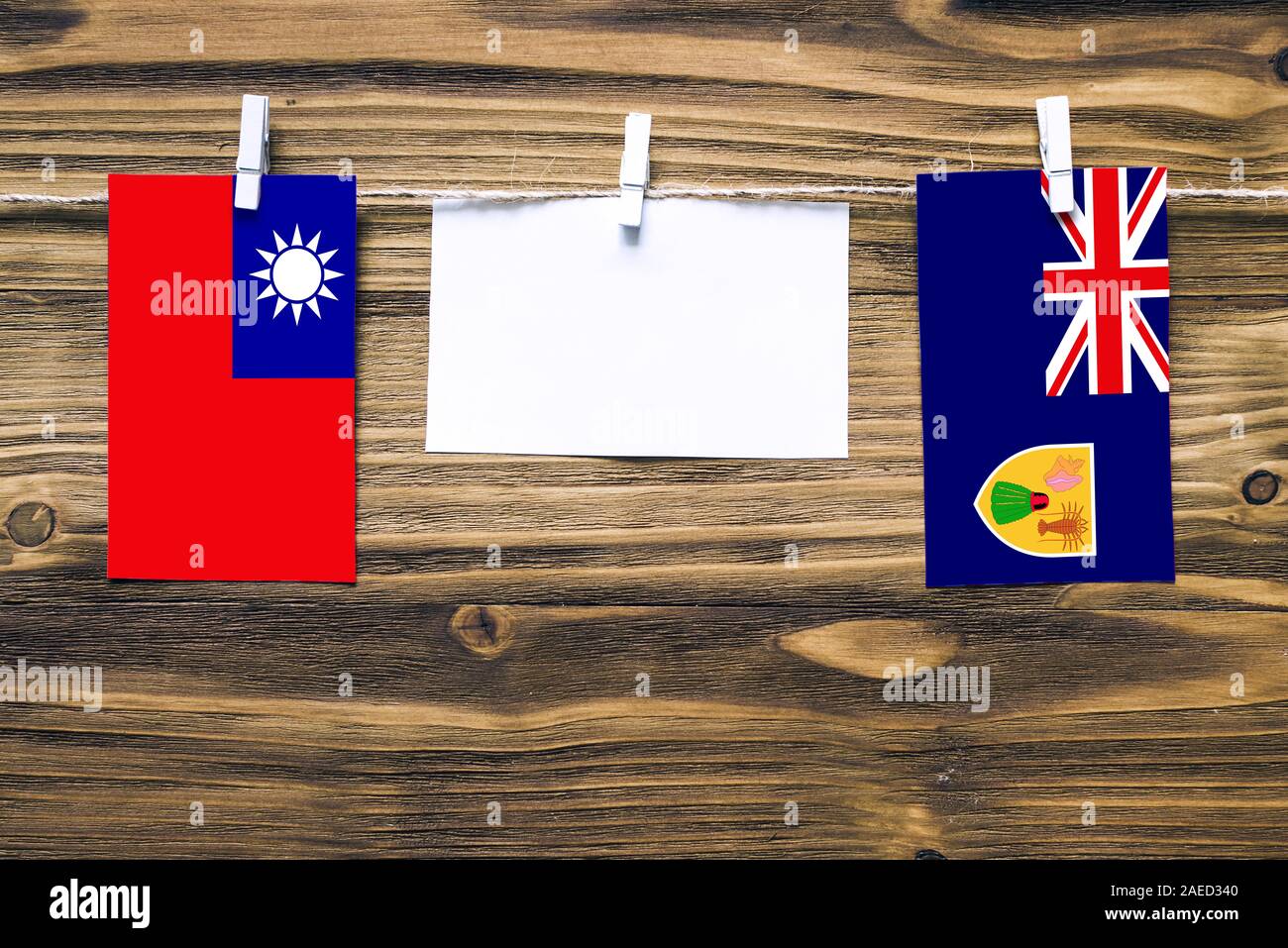 Hanging flags of Taiwan and Turks And Caicos Islands attached to rope ...