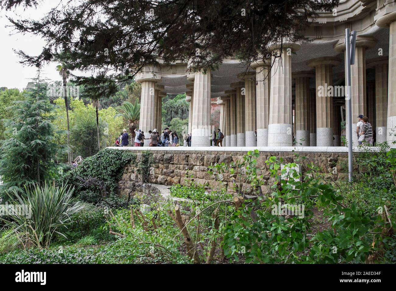 Tourists enjoying the architectural and visual delights of Park Guell ...