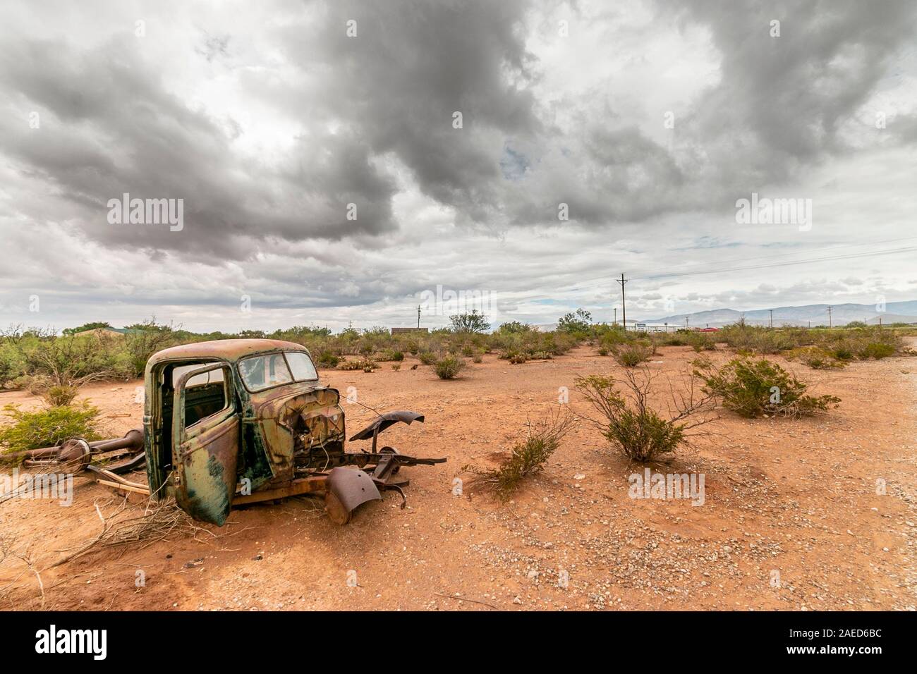 rusty classic vintage American car in the desert on historic Route 66 ...
