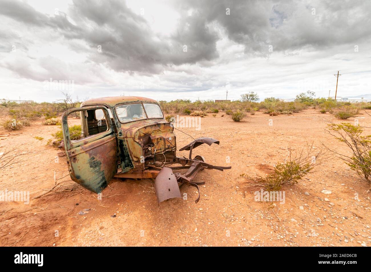rusty classic vintage American car in the desert on historic Route 66 ...