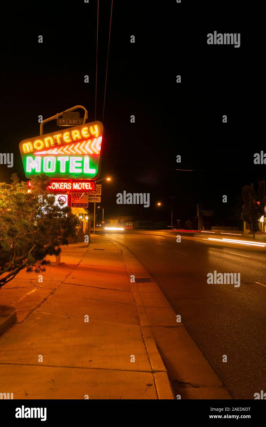 illuminated old neon Monterey Motel sign at night on historic Route 66 ...
