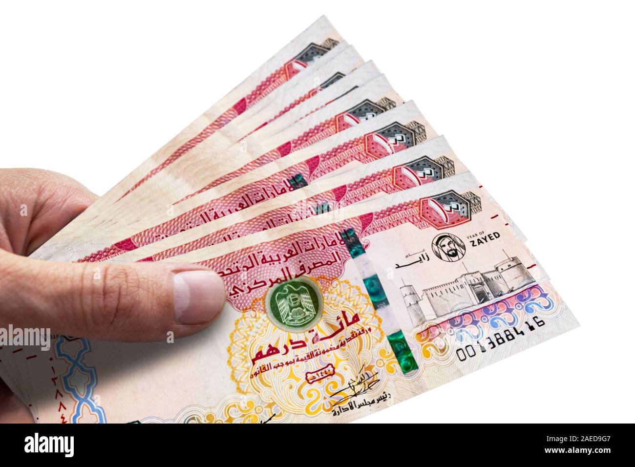 Hand holding dirhams of United Arab Emiratess. AED. Currency of UAE ...