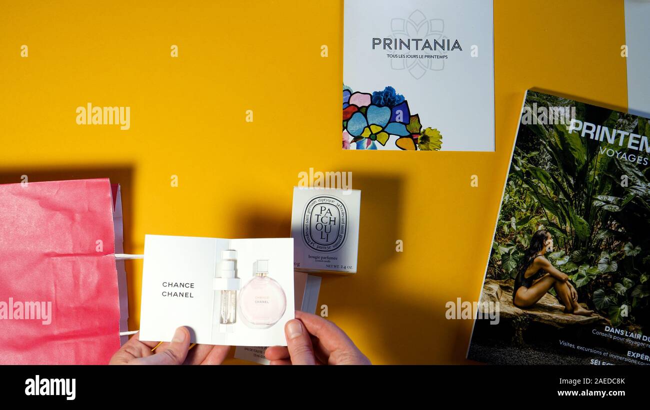 Paris, France - Nov 22, 2019: Overhead view of woman unboxing unpacking ...