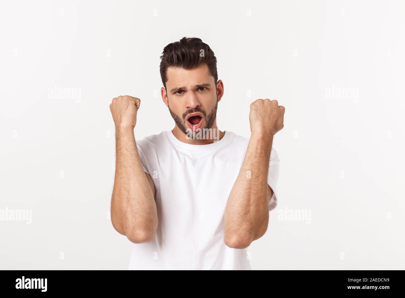 Portrait of young man with shocked facial expression, isolated over ...