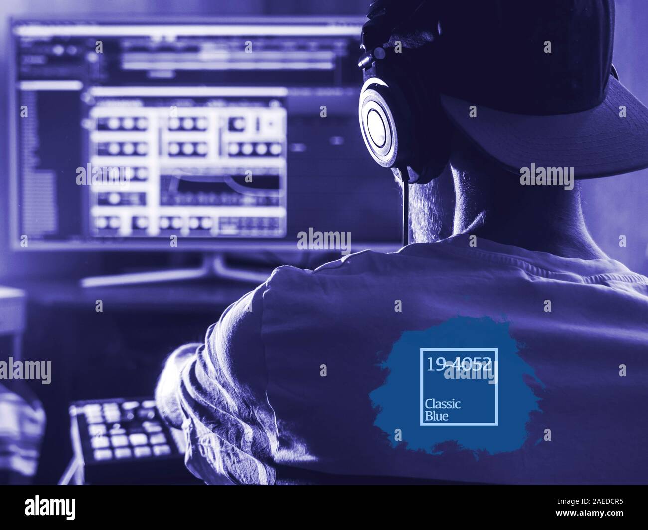 young male sound engineer working in professional music studio with ...