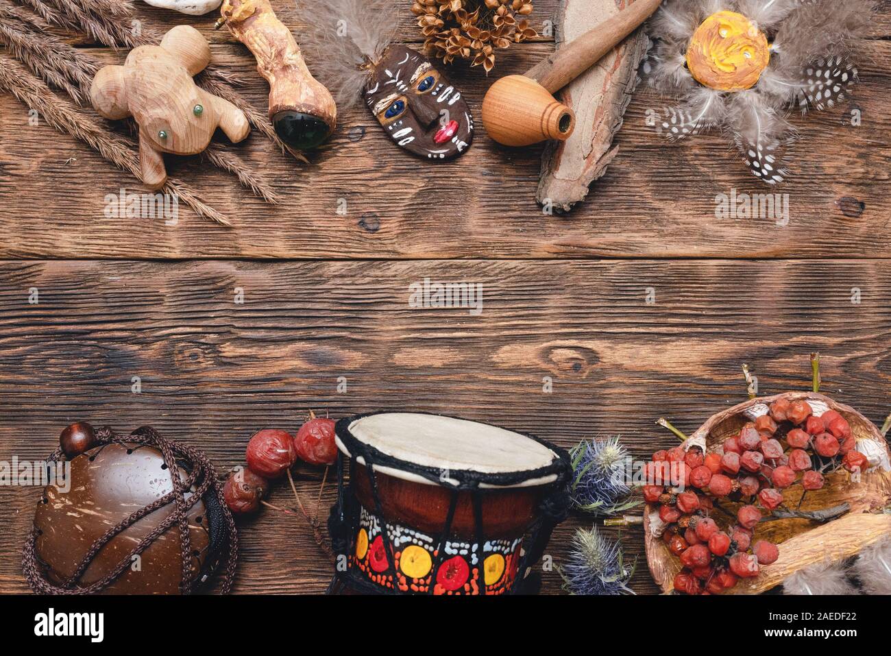 Shaman accessories on wooden table background. Magic equipment concept ...
