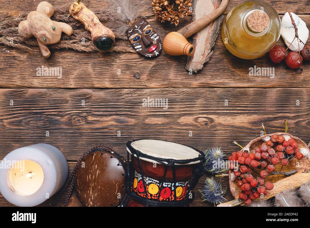 Shaman accessories on wooden table background. Magic equipment concept ...
