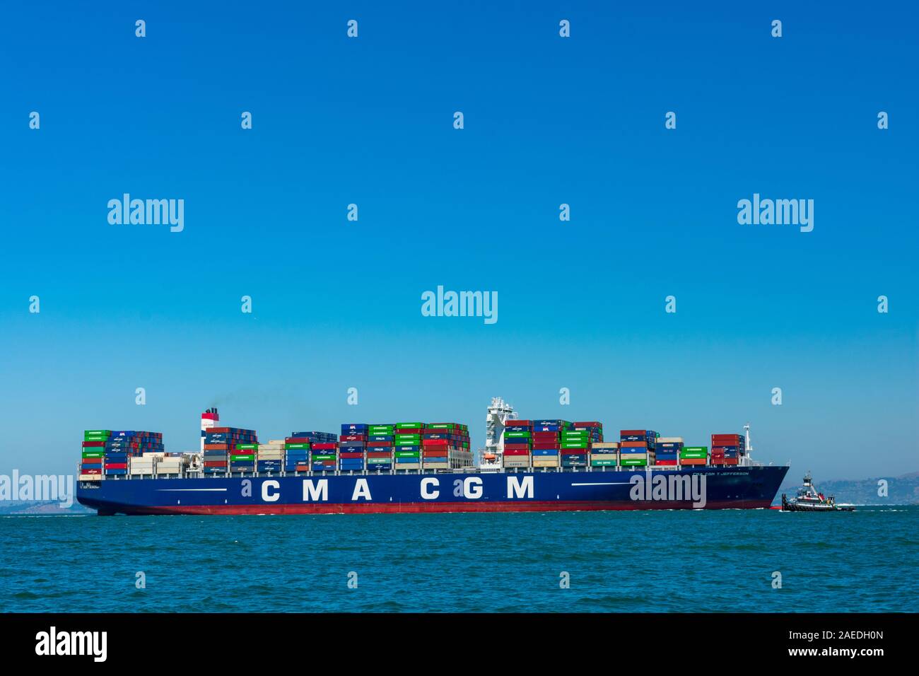 Container cargo ship CMA CGM loaded with colorful containers navigates ...