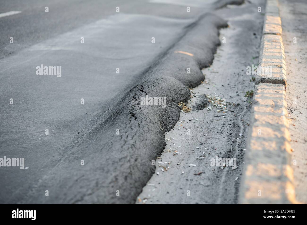 Floating substandard asphalt. Poor quality road Stock Photo - Alamy