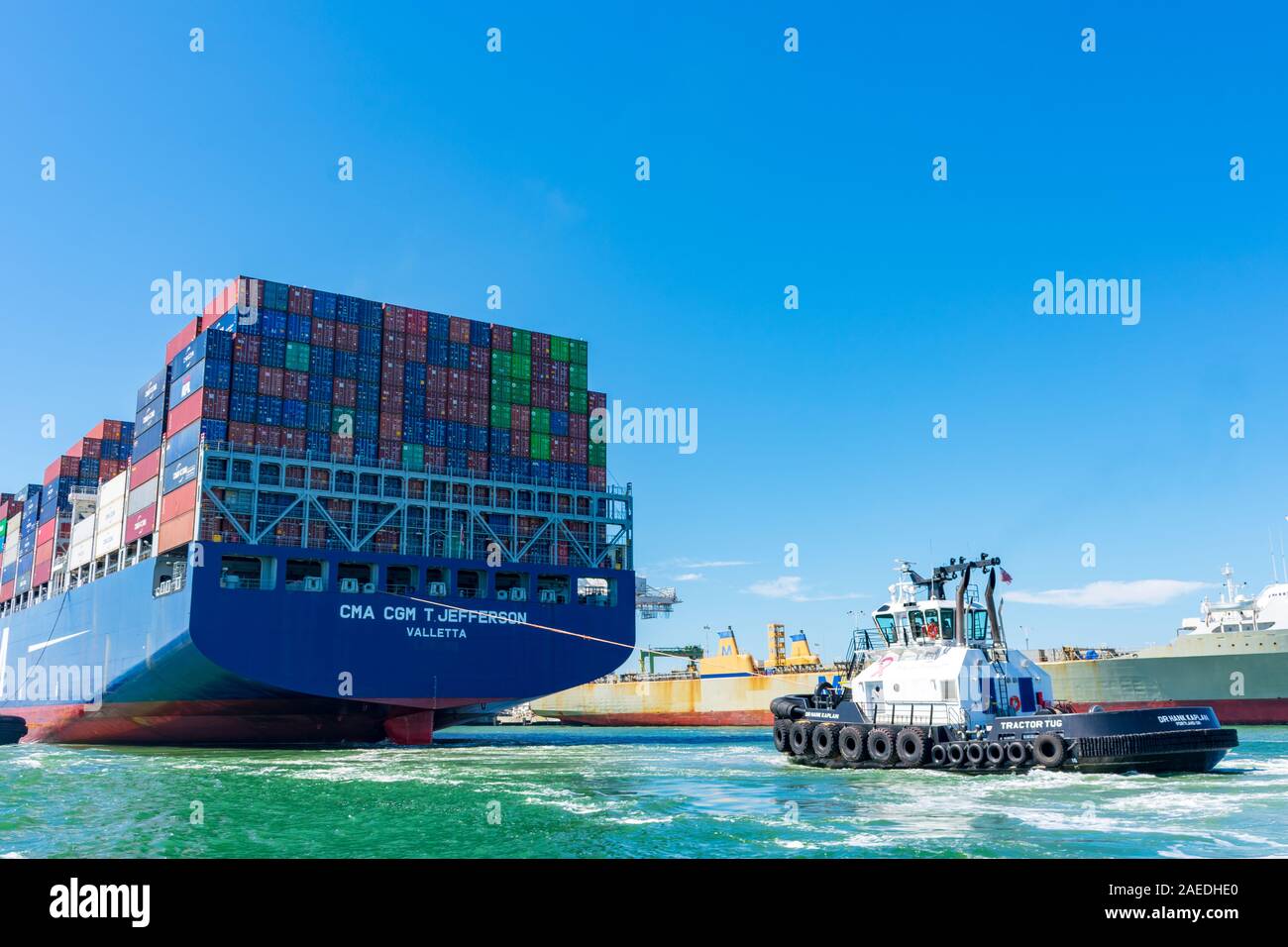 Tugboat assists container ship CMA CGM out of the Port of Oakland under ...