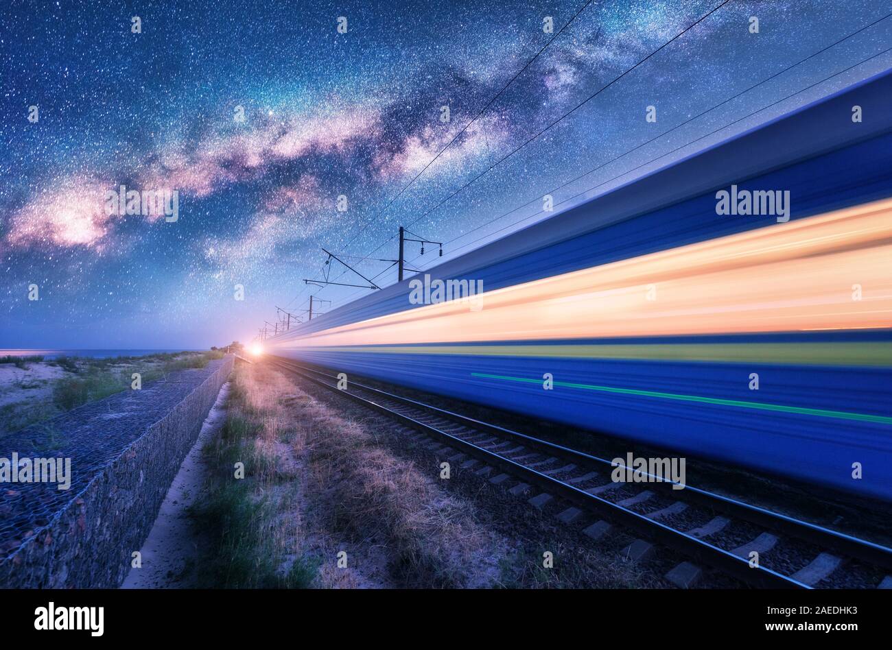 High speed train in motion and Milky Way at starry night Stock Photo ...