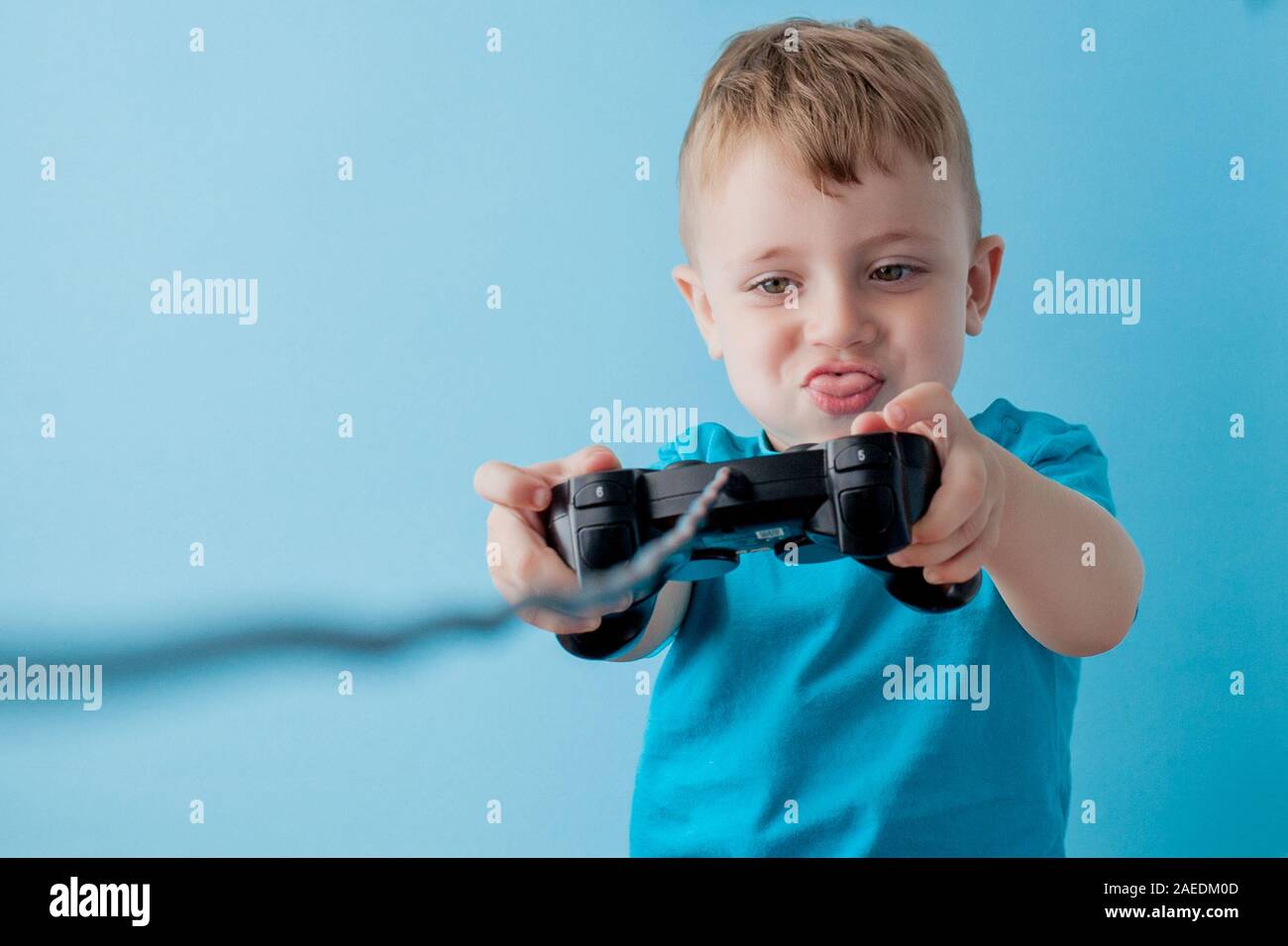 Kids playing handheld video game hi-res stock photography and images ...