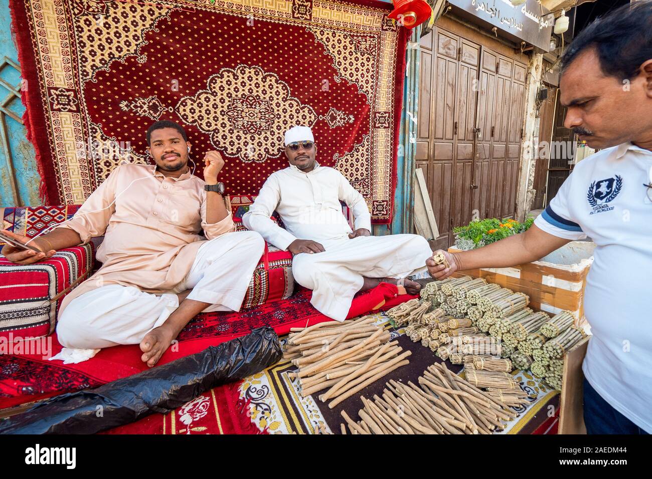 Two Arabic men sell miswak teeth cleaning twigs on the Souk Baab Makkah ...