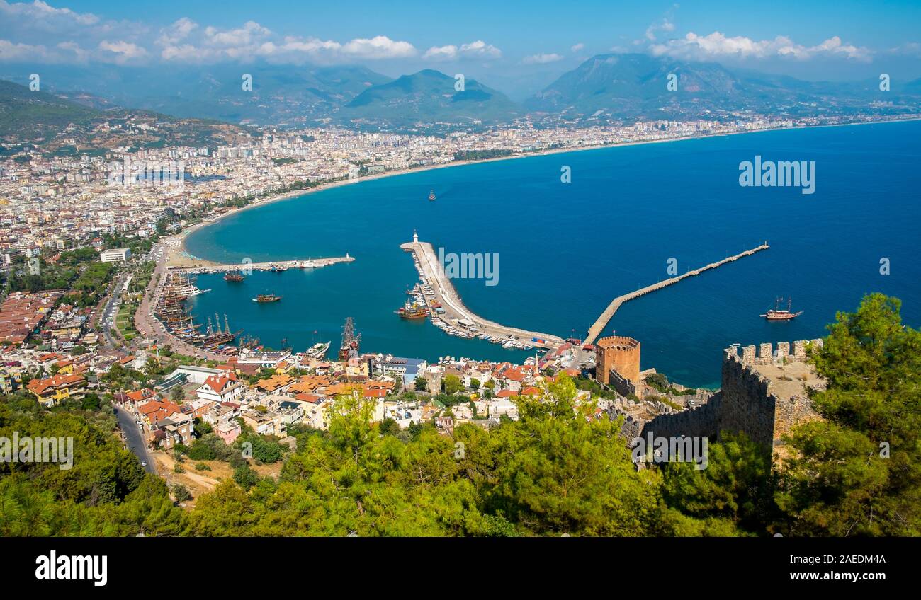 Alanya beach top view on the mountain with coast ferry boat on blue sea ...
