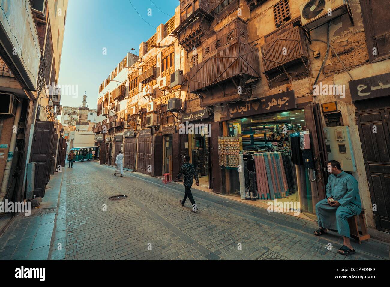 View of the Suq Al Jami street with old coral town houses and Al Shafee ...