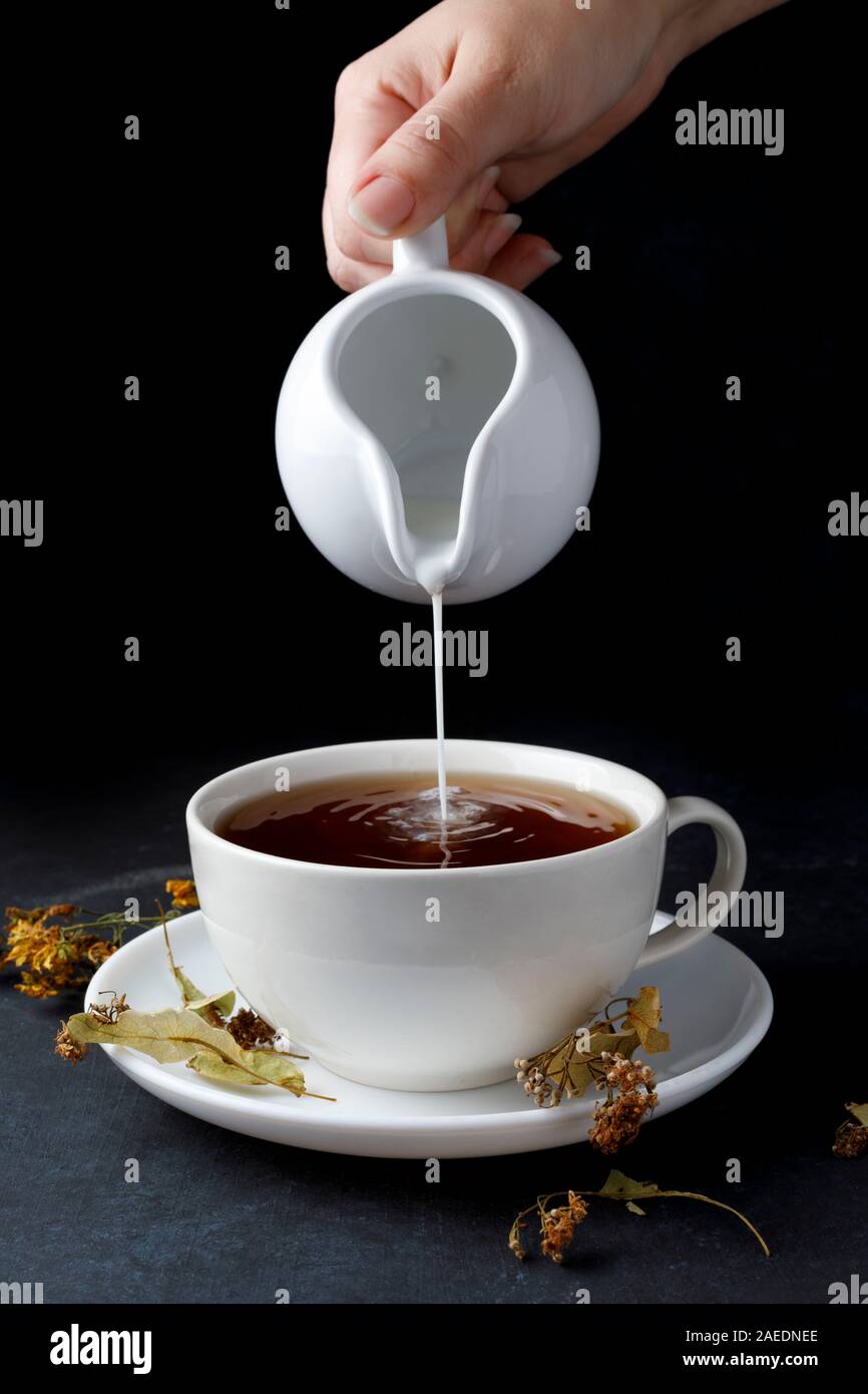Tea cup with milk drop hi-res stock photography and images - Alamy