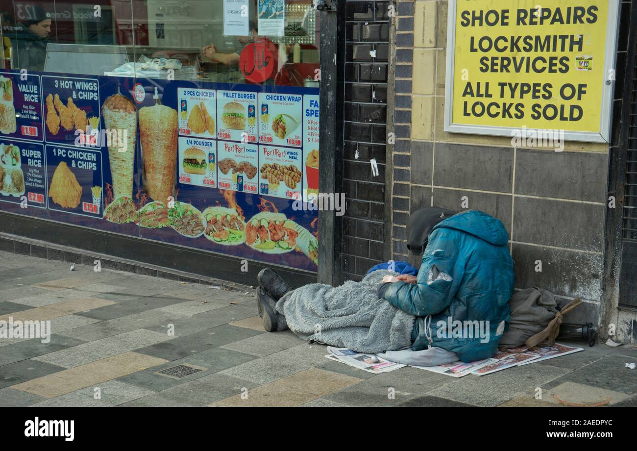 Homeless man sleeping in the street in Ilford,England,UK Stock Photo ...