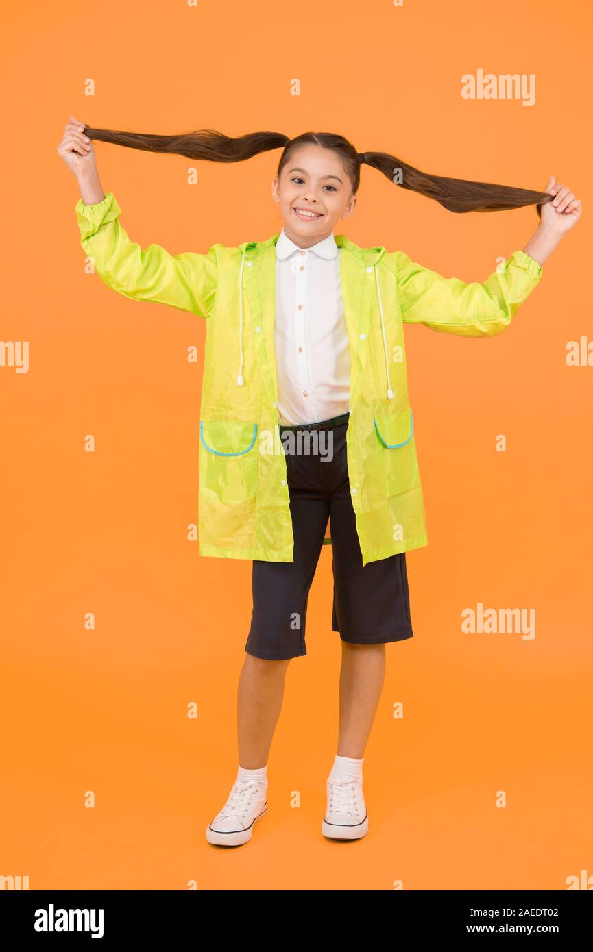Kids raincoats with vibrant shapes unique designs. Schoolgirl wear ...