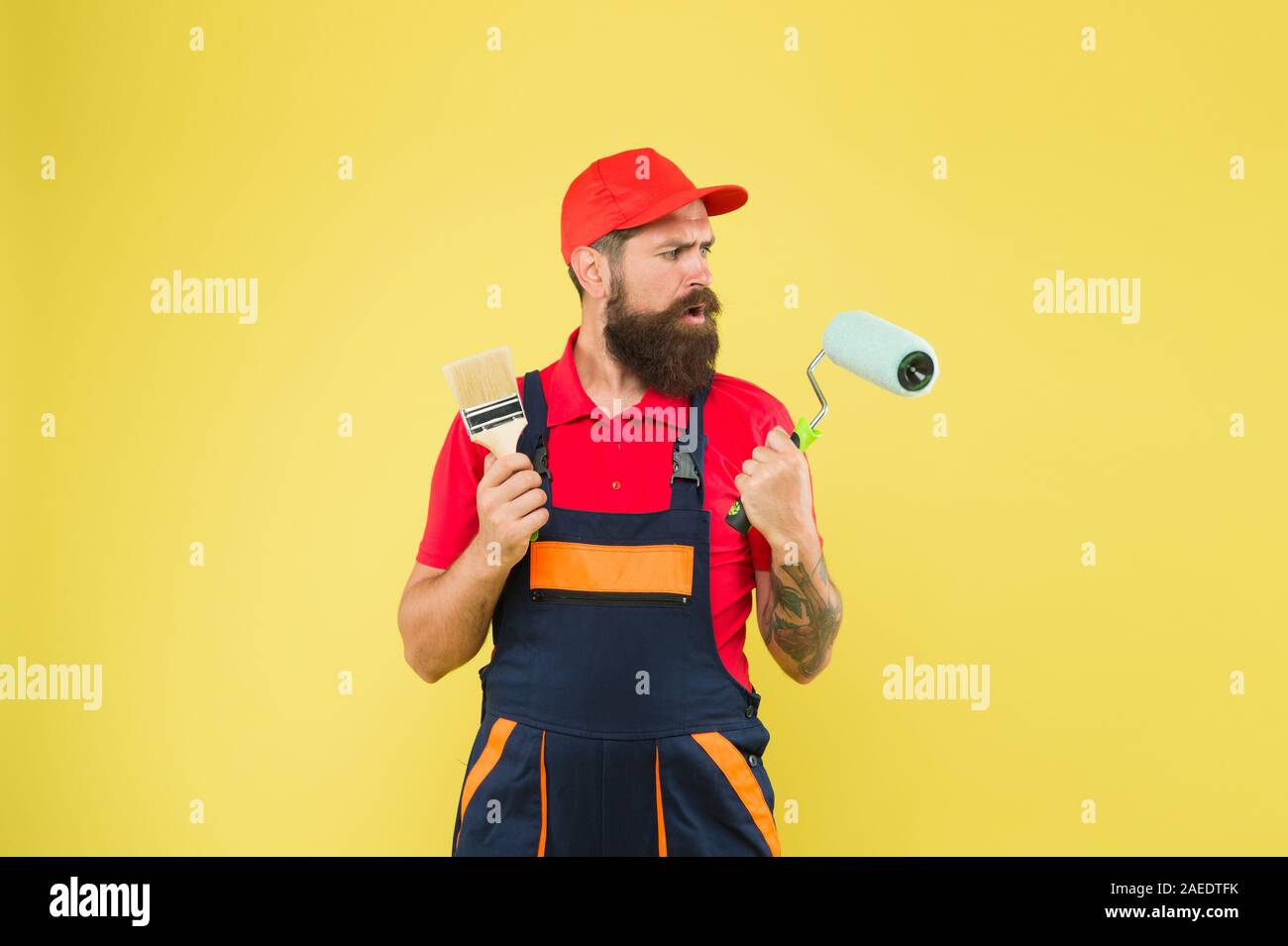 Apply vinyl paint. Pick tools. Painting tool. Brush roller painter. Man ...