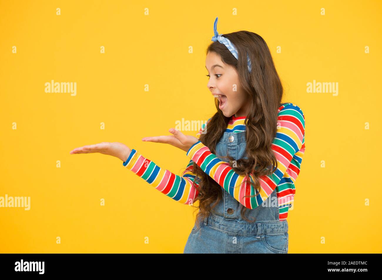 Girl demonstrate product. Promoting product for kids. Launching product ...