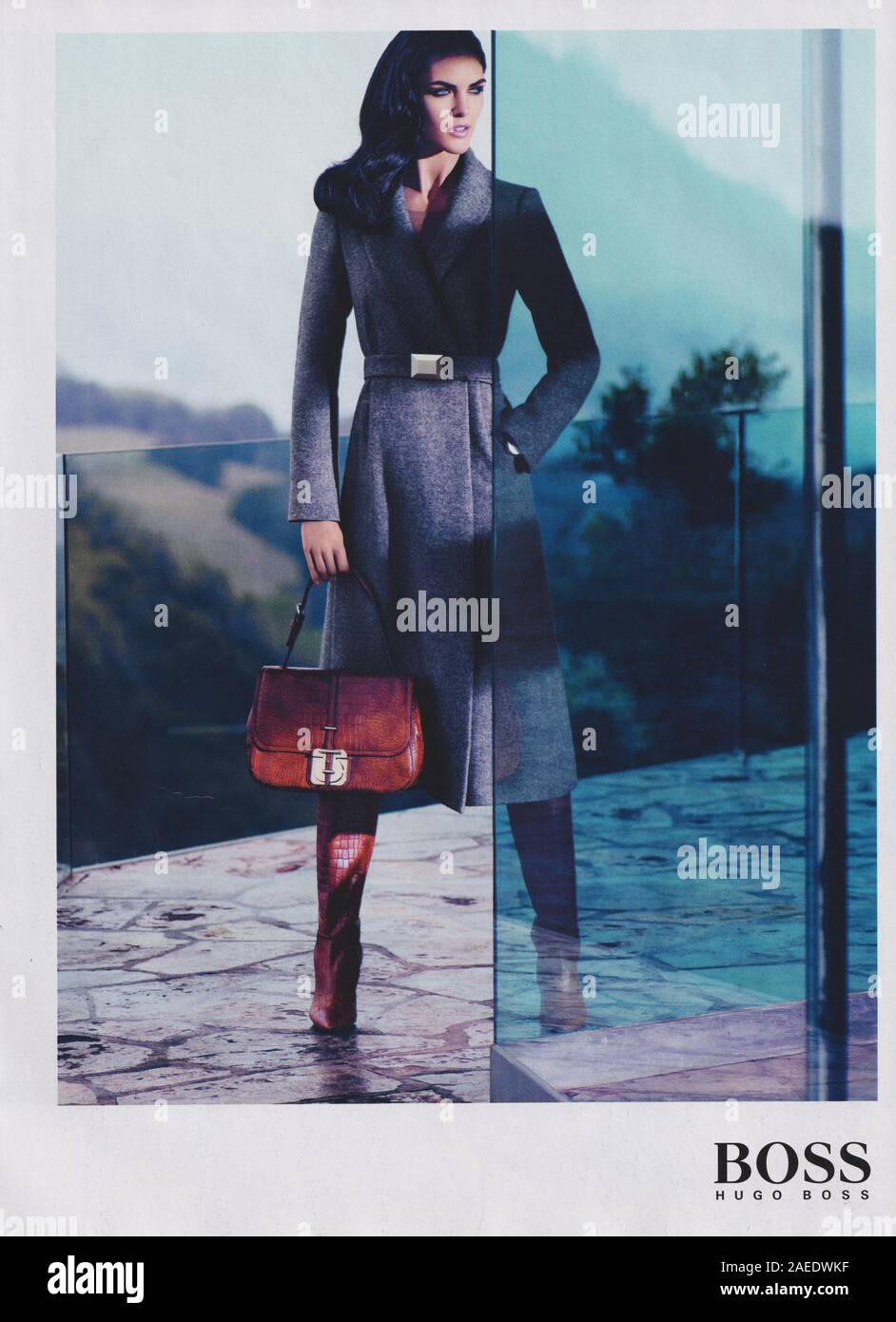 poster advertising Hugo Boss fashion house with Hilary Rhoda in paper ...