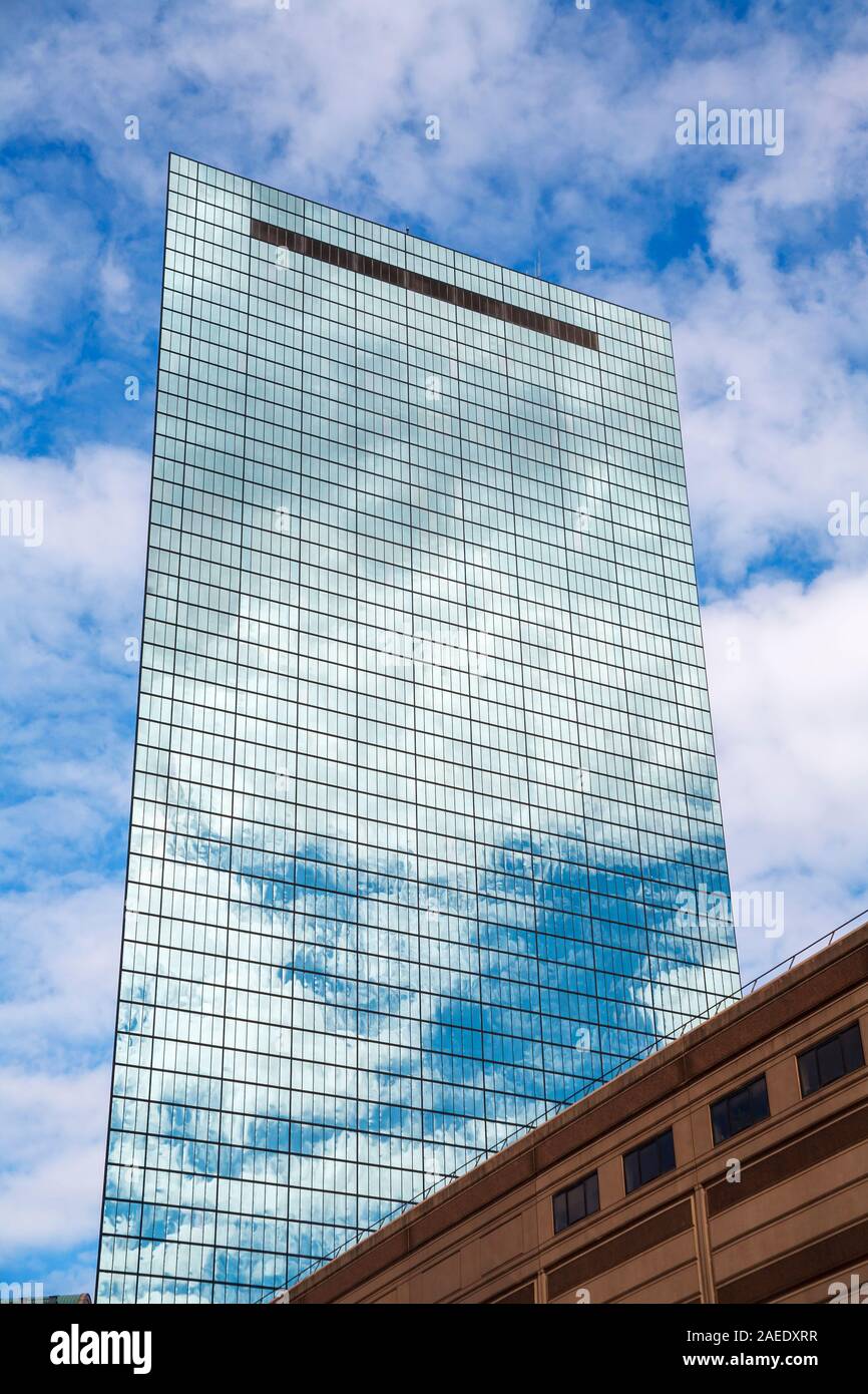 The iconic tall modern skyscraper John Hancock Tower reflecting clouds ...