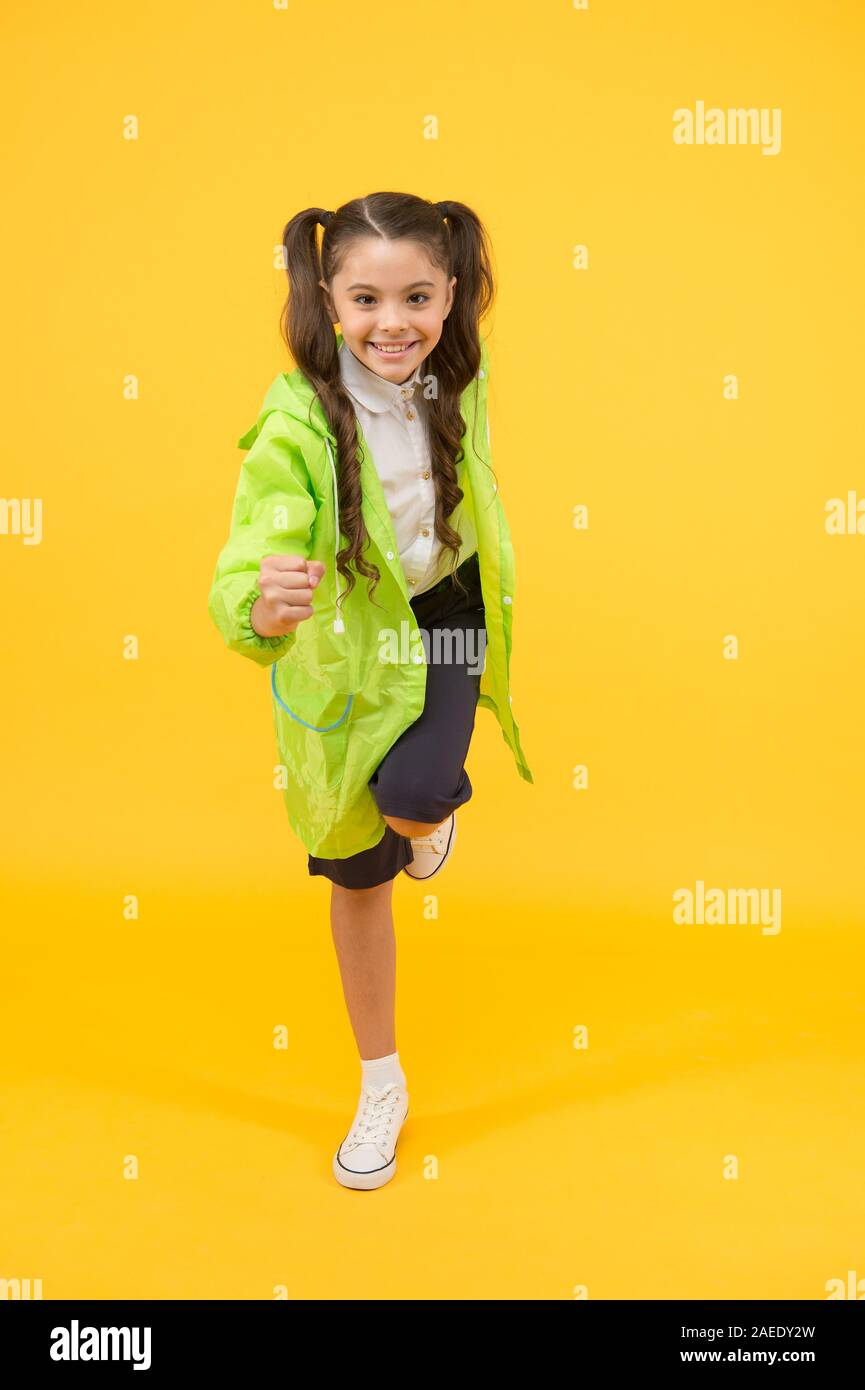 Schoolgirl wear raincoat. Kids raincoats with vibrant shapes unique ...